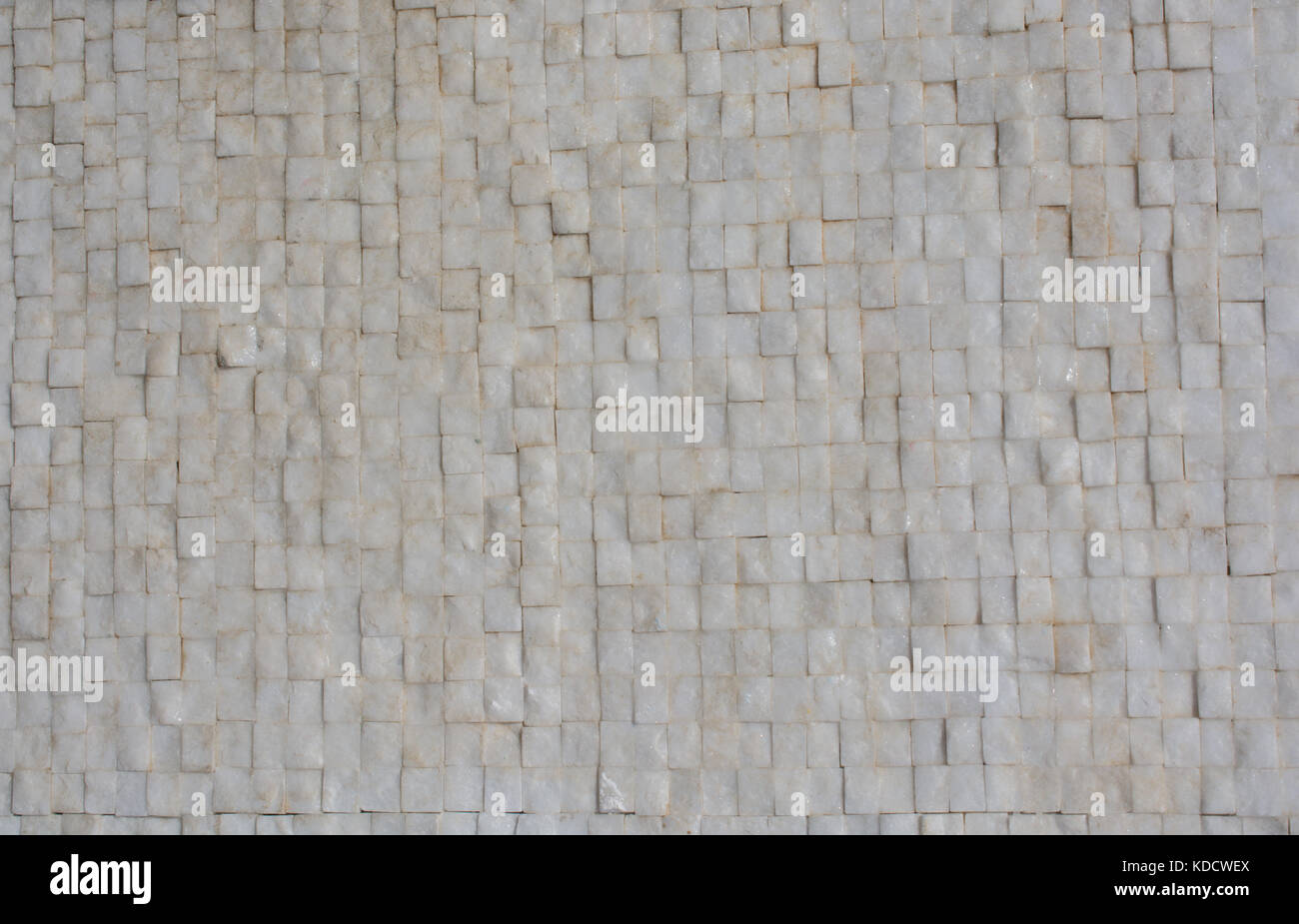 Decorative cubic stone wall as background texture Stock Photo - Alamy
