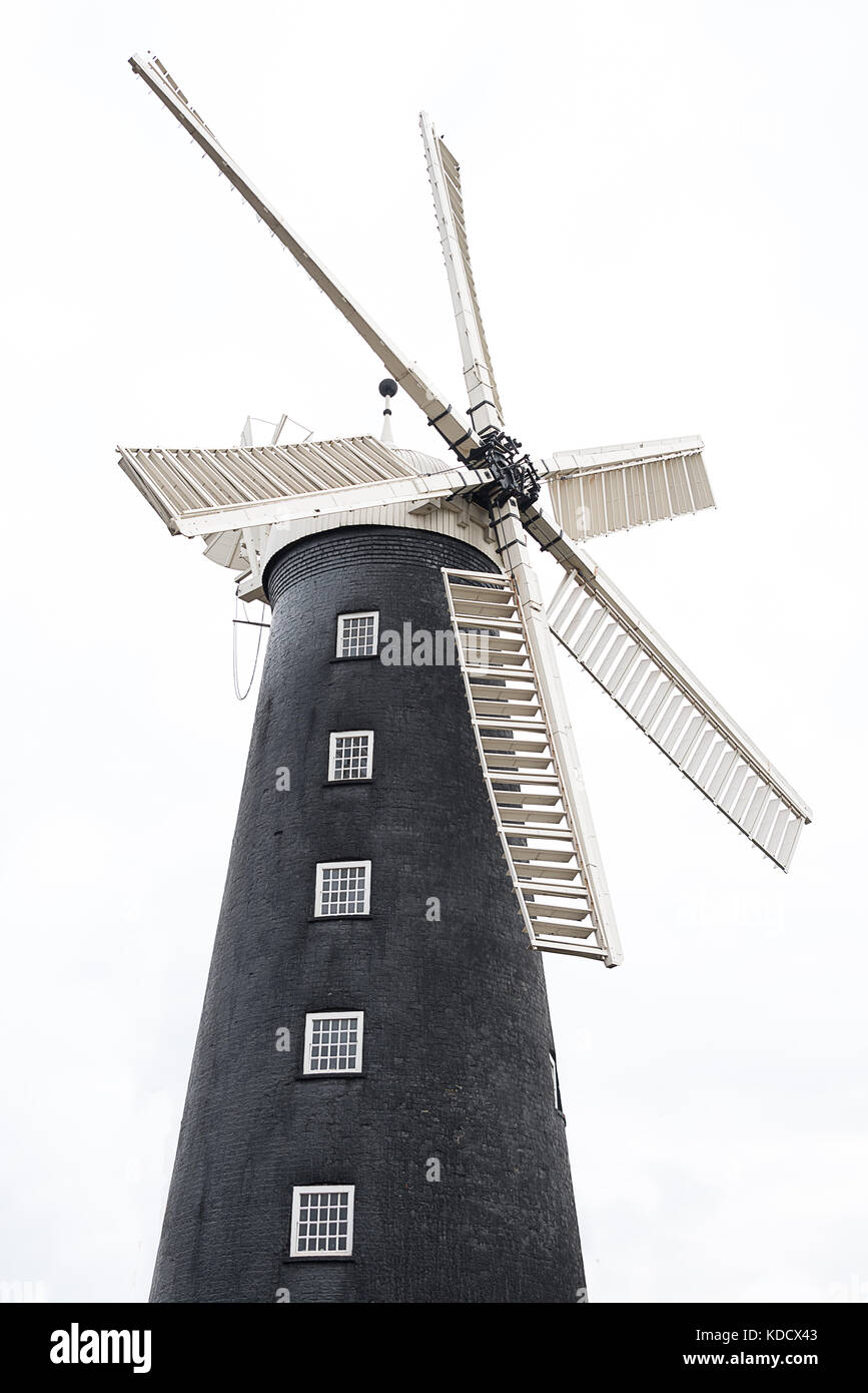 A half length upright photograph of a windmill with six sails isolated ...