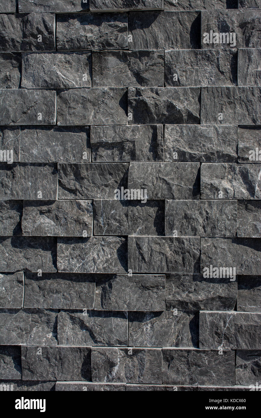 Decorative cubic stone wall as background texture Stock Photo - Alamy