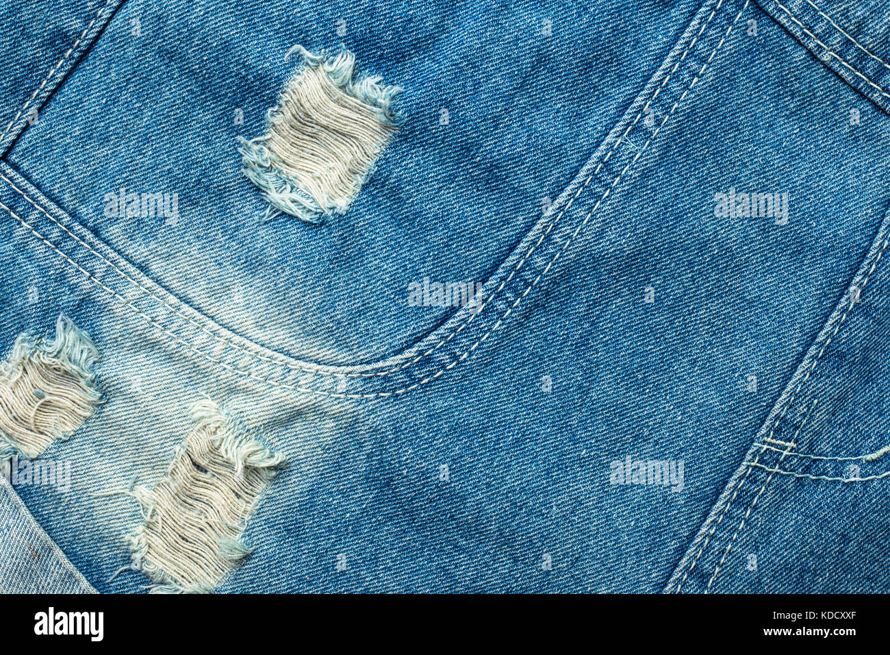 Rip denim jeans background with seam of jeans fashion design Stock ...