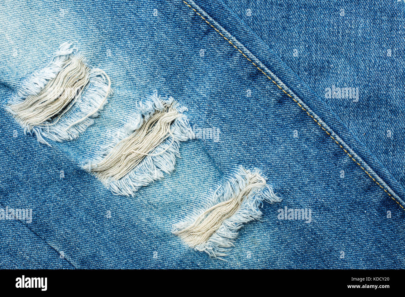 Rip denim jeans background with seam of jeans fashion design Stock ...