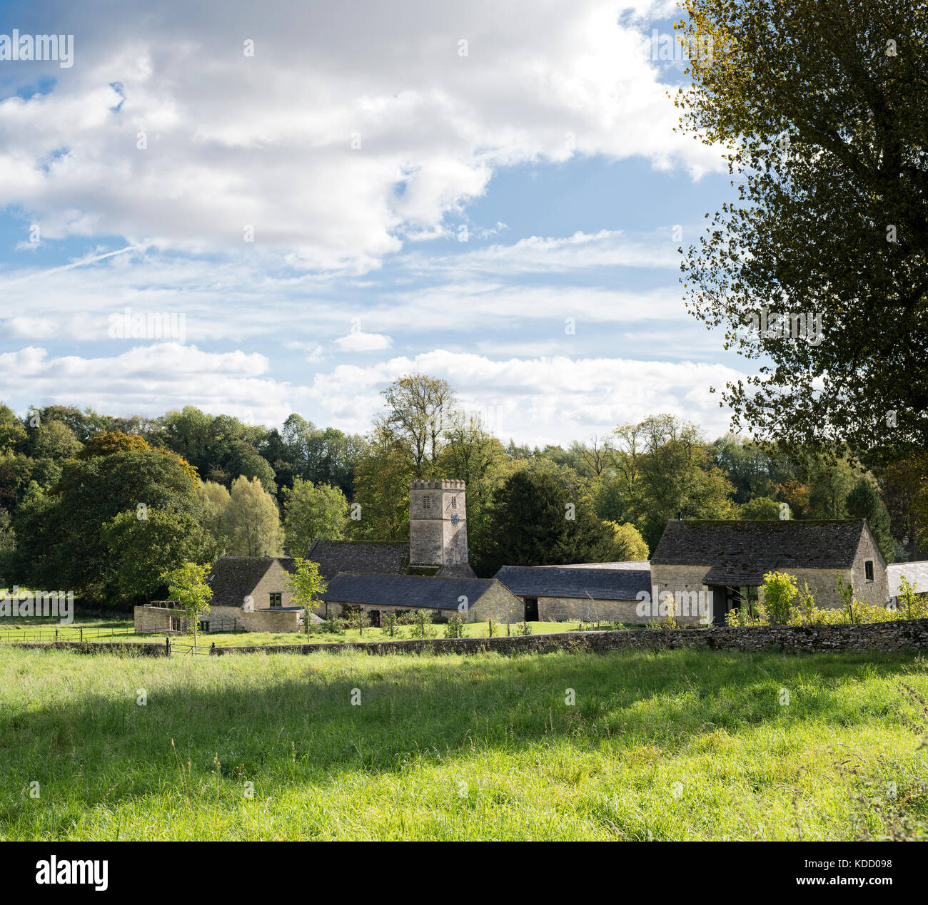 St Andrews Church and barns in autumn, Coln Rogers, Cotswolds ...
