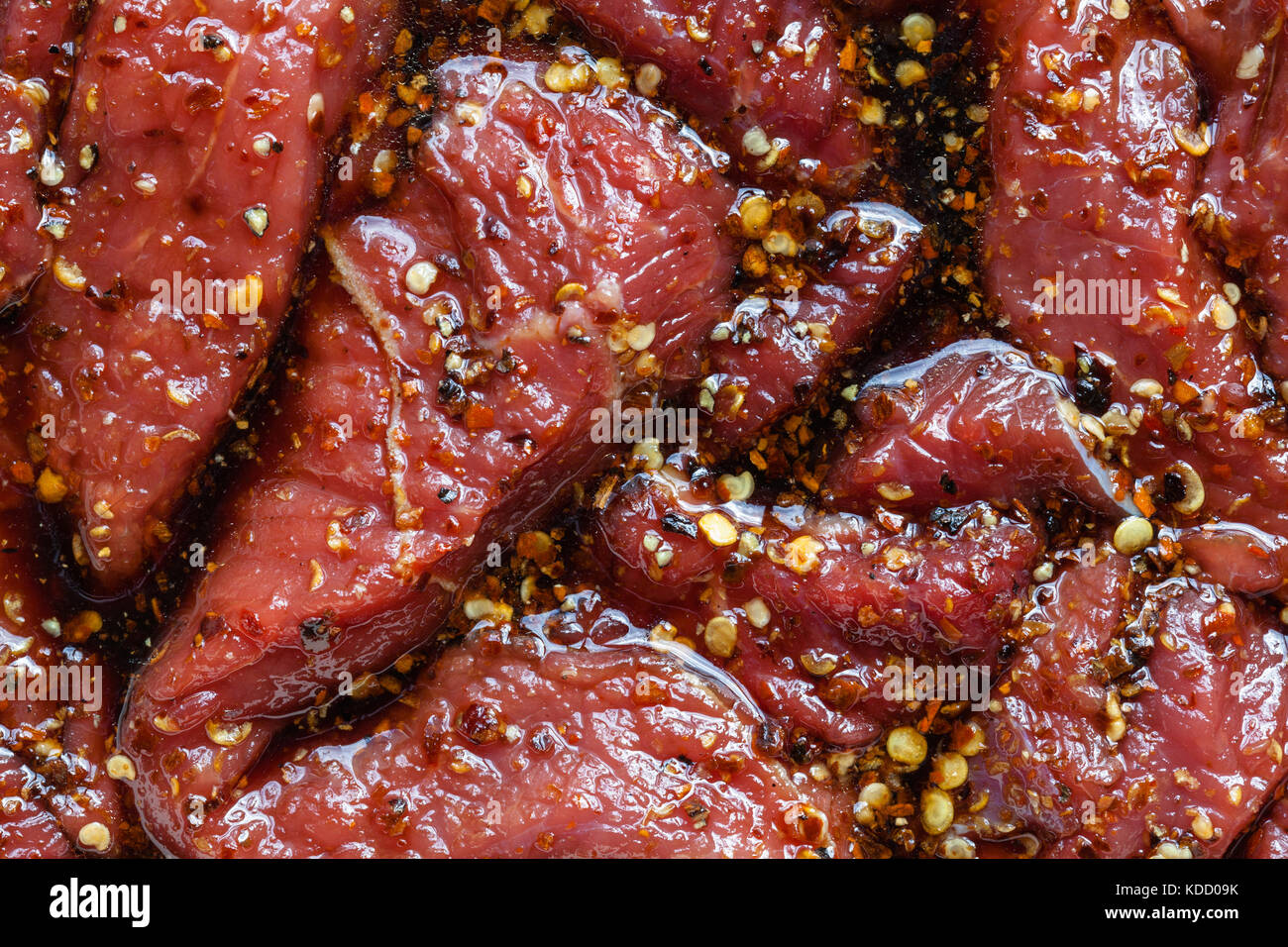 Lean beef being marinated for further processing Stock Photo - Alamy