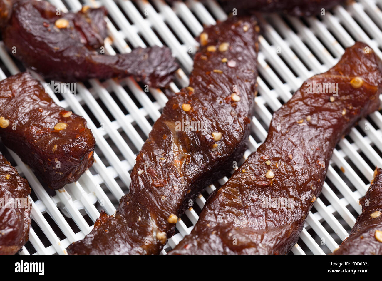 Perfectly marinated pieces of lean beef are being dried Stock Photo - Alamy