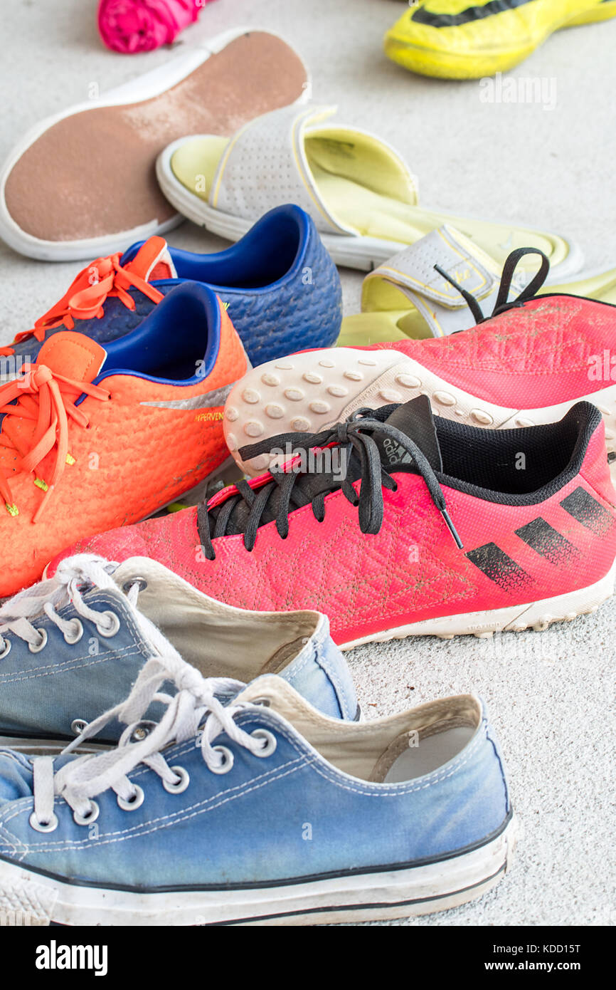 Children's shoes dropped on a front porch Stock Photo - Alamy