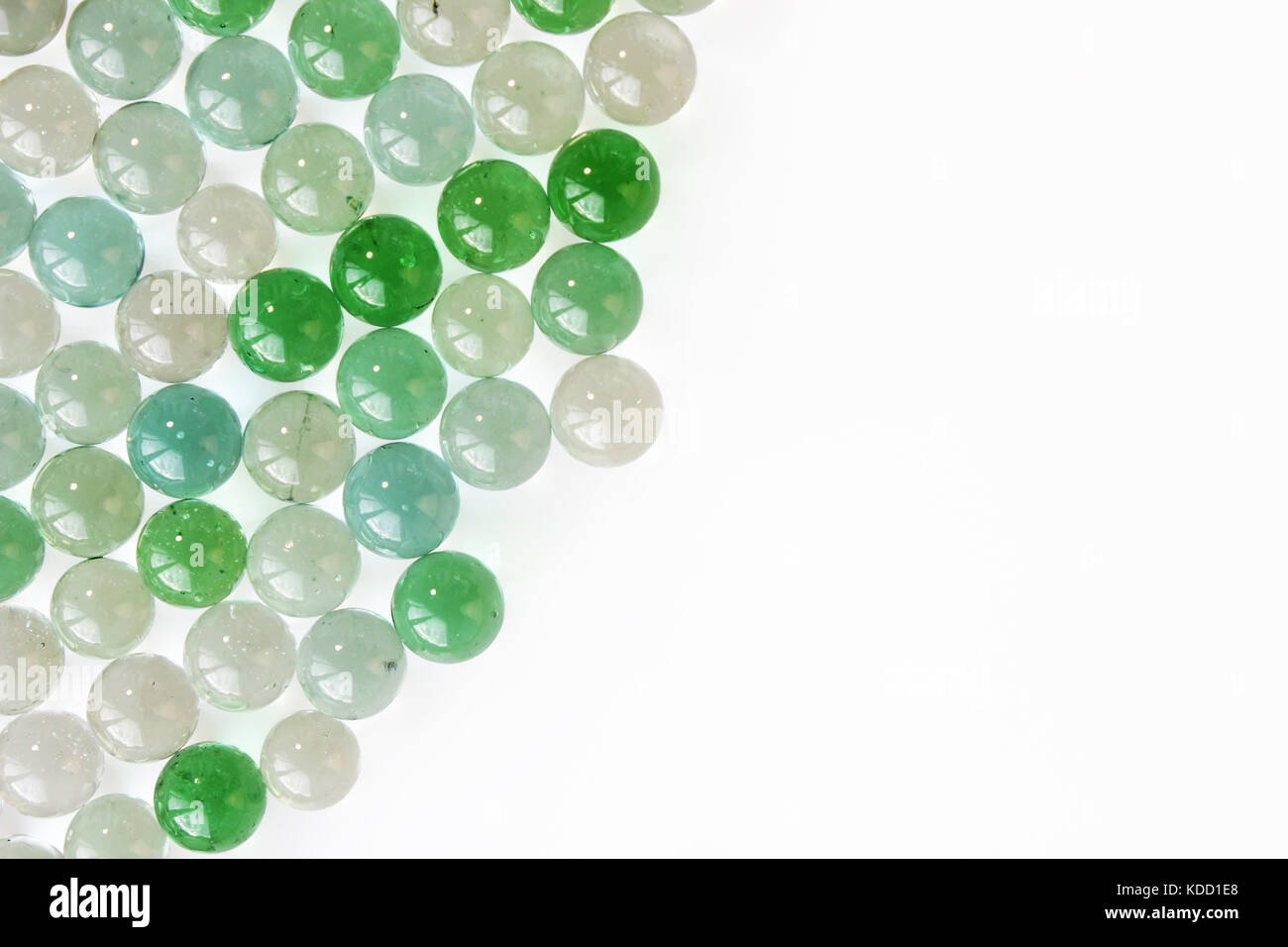 many small glass balls on a white background Stock Photo - Alamy