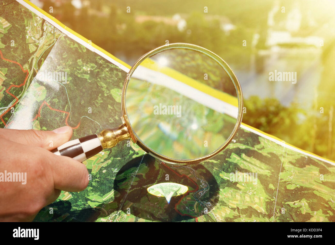Magnifying glass against map Stock Photo - Alamy