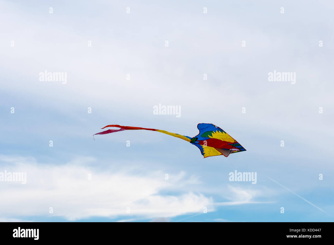 Flying kite in the air. Dark clouds on the background. Autumn windy ...