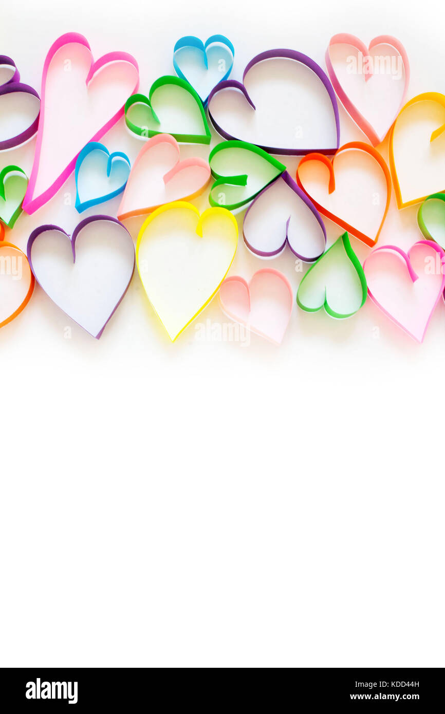 Bright colored hearts made of paper. White background Stock Photo - Alamy
