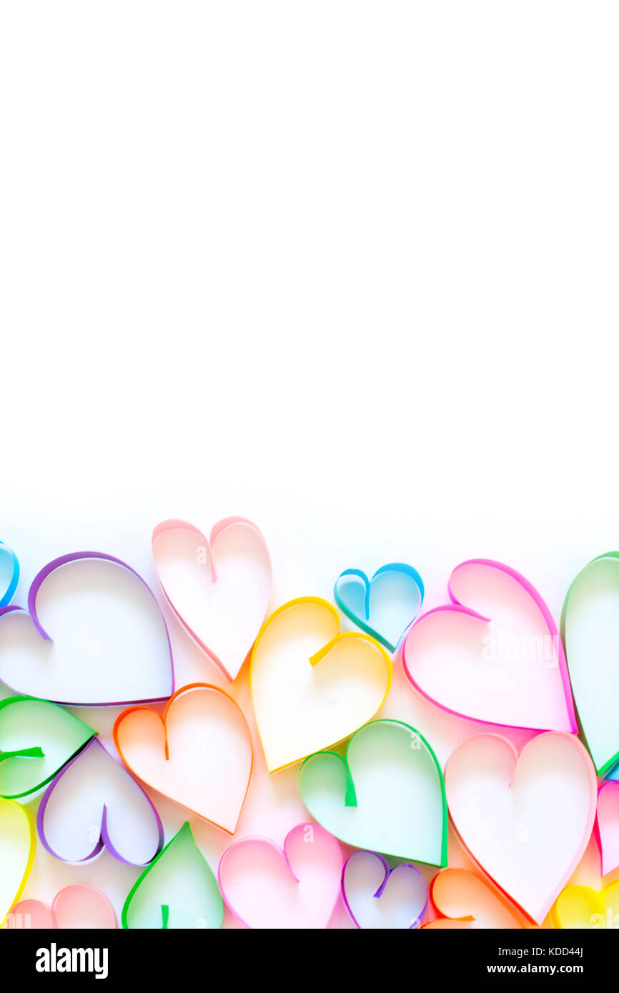 Bright colored hearts made of paper. White background Stock Photo - Alamy