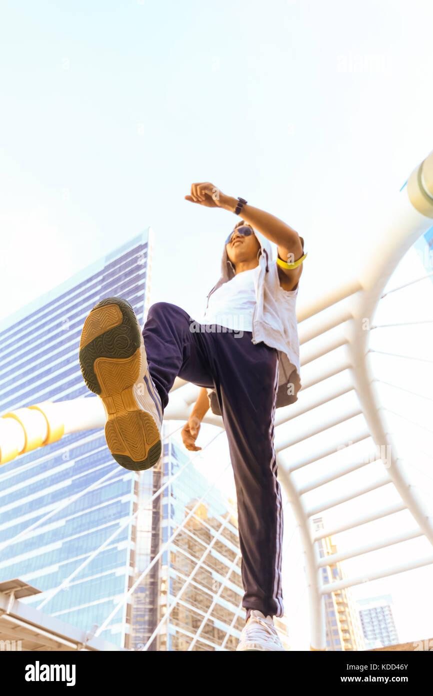 Young man jumping jogging in hi-res stock photography and images - Alamy