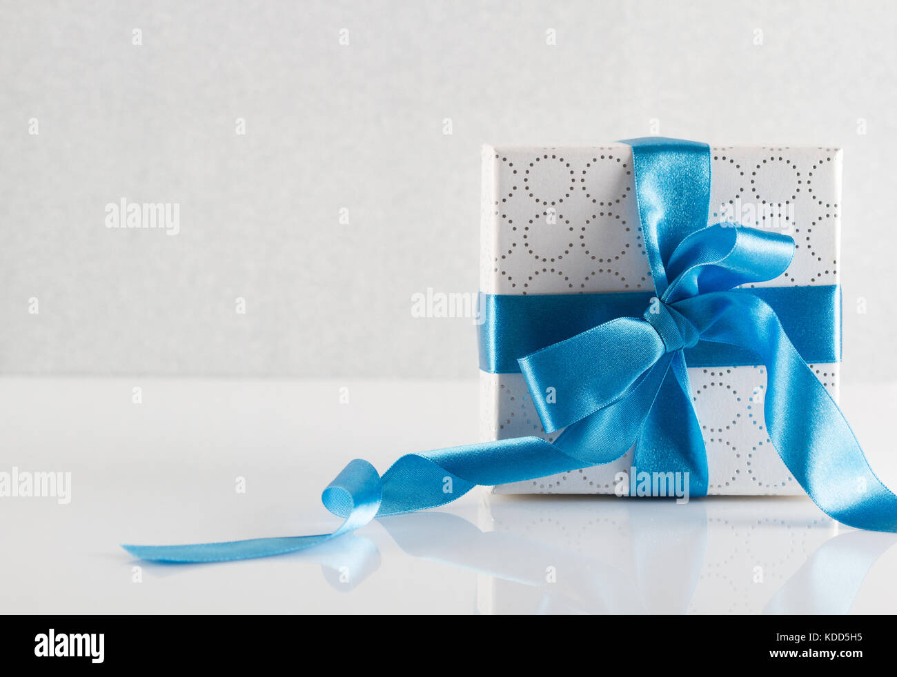 Gift box with ribbon on white background Stock Photo - Alamy