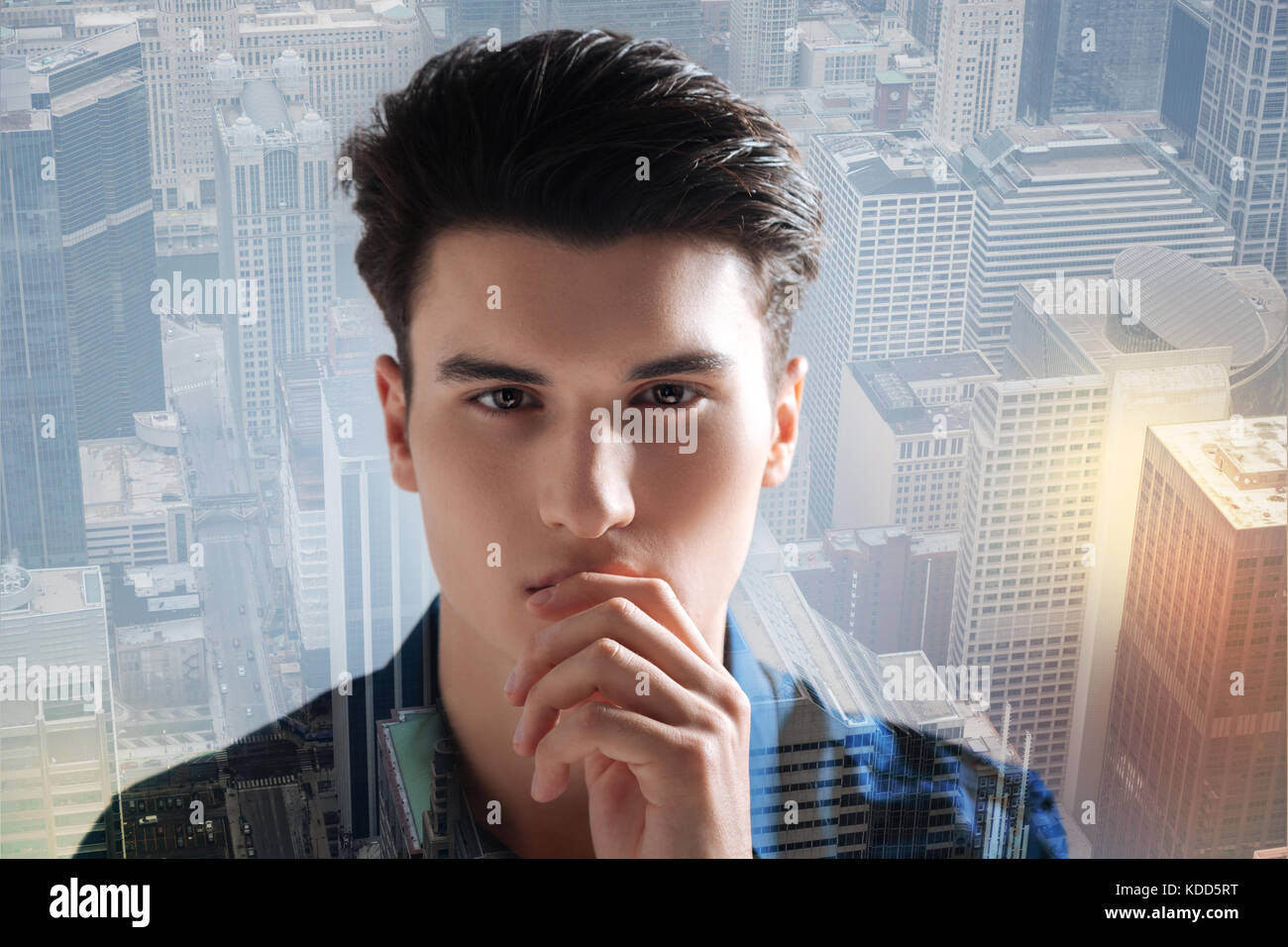 Thoughtful model touching his chin with a hand Stock Photo - Alamy