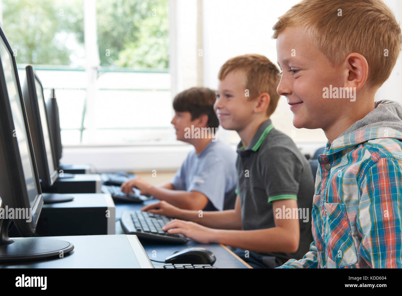 Group Of Male Elementary School Children In Computer Class Stock Photo ...