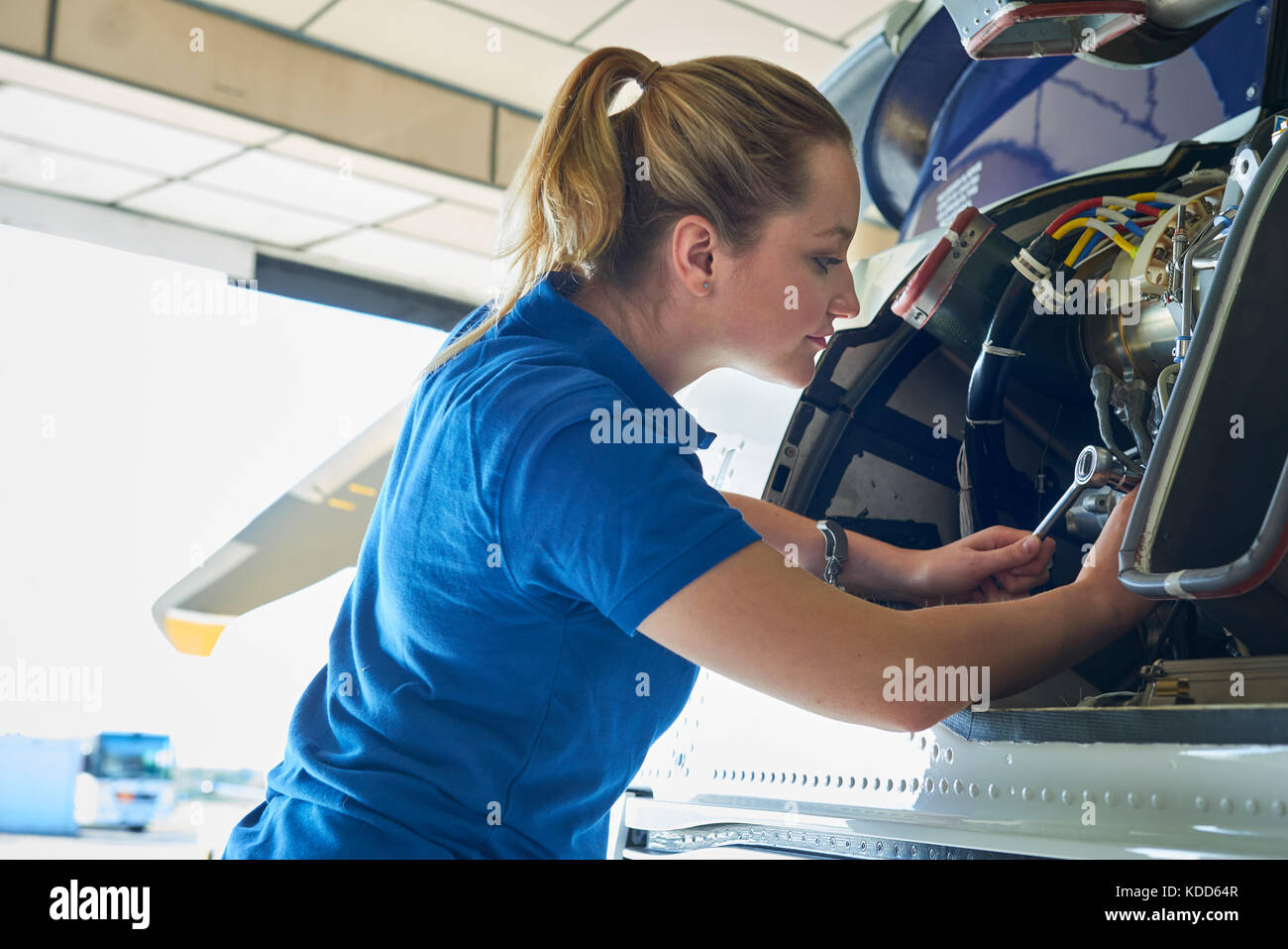 Female Aero Engineer Working On Helicopter In Hangar Stock Photo - Alamy
