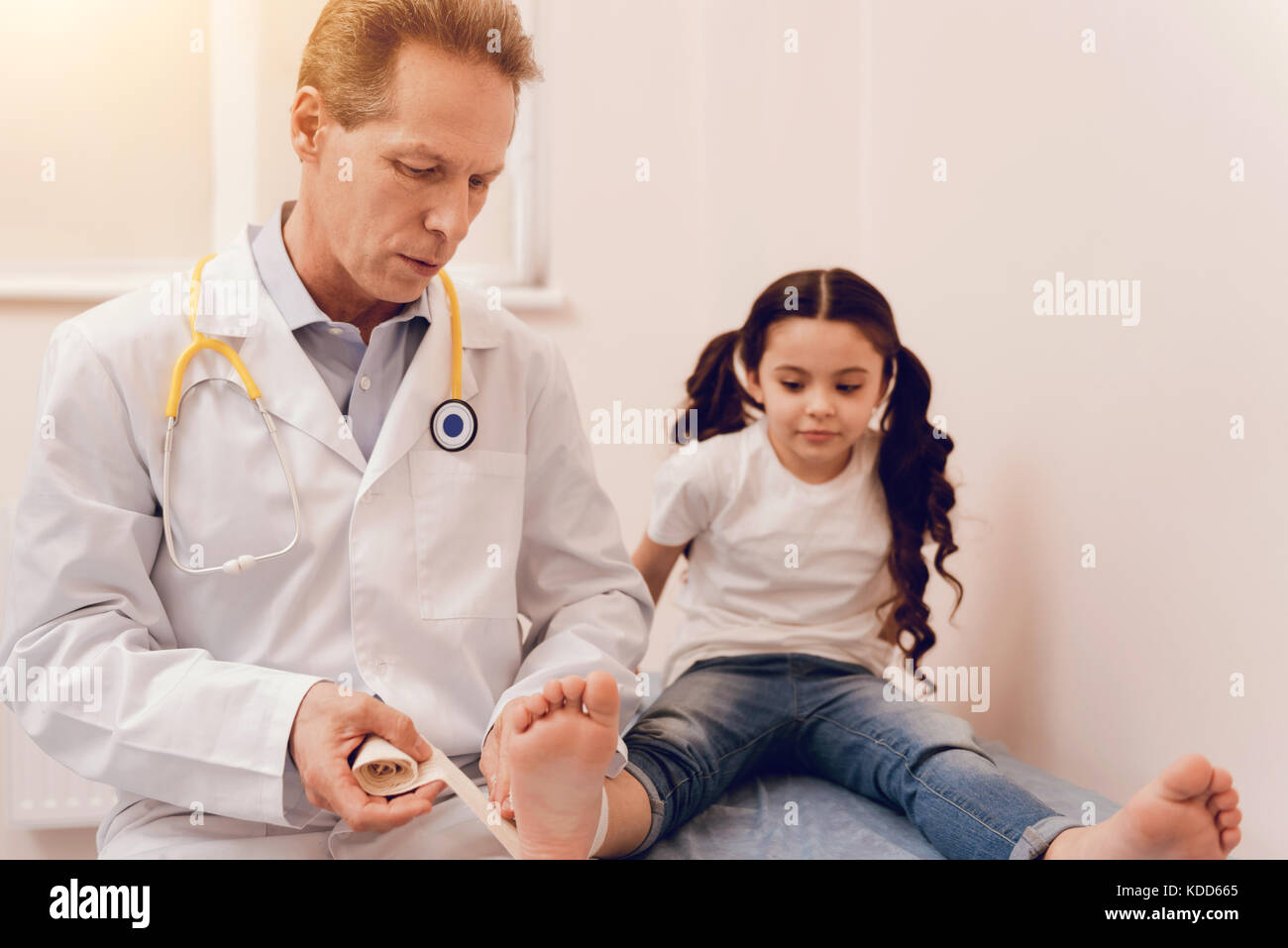 Attentive male person looking downwards Stock Photo - Alamy