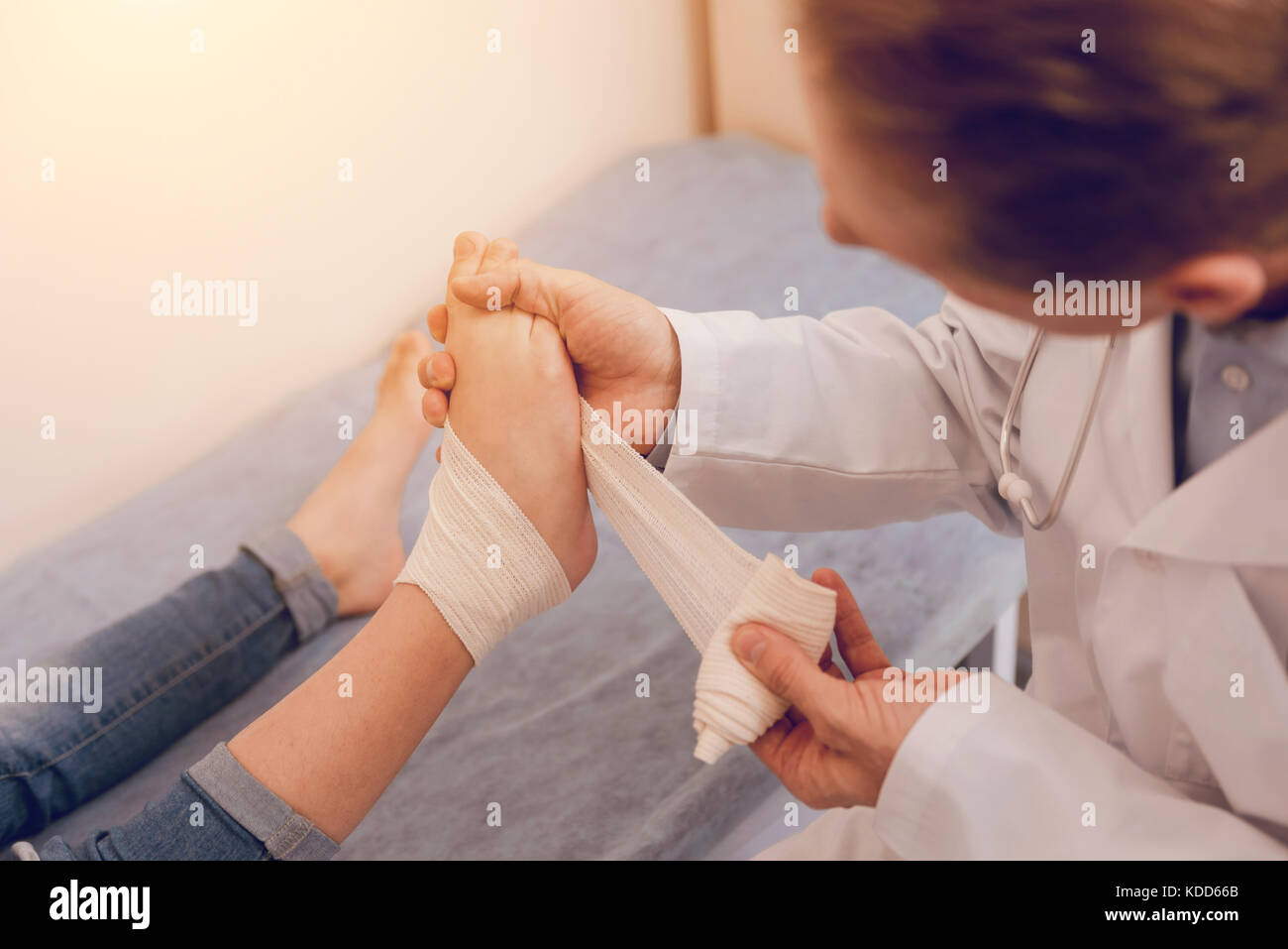 Serious young man dressing the wound Stock Photo - Alamy