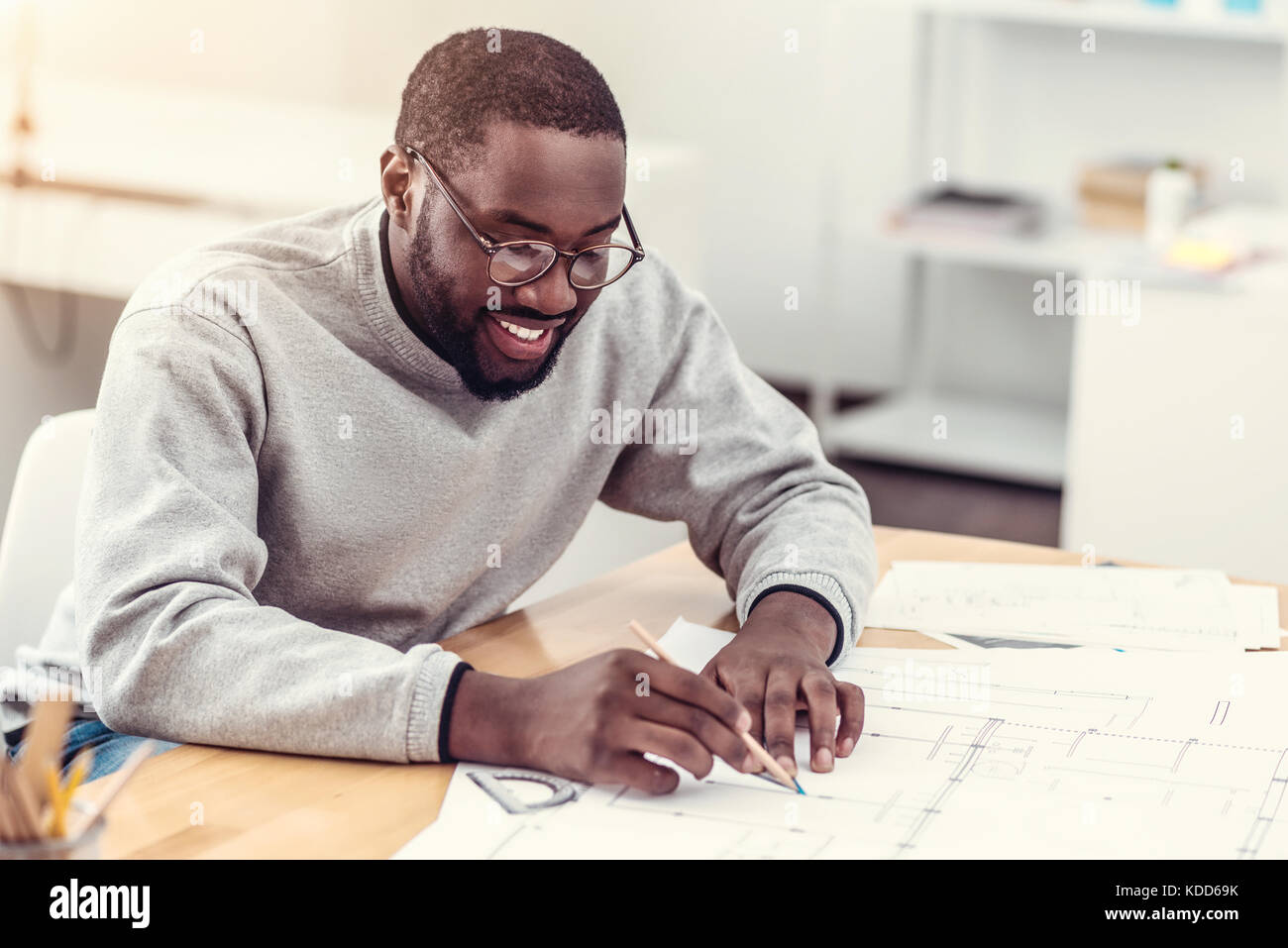 Hard working technical professional drawing at work Stock Photo - Alamy