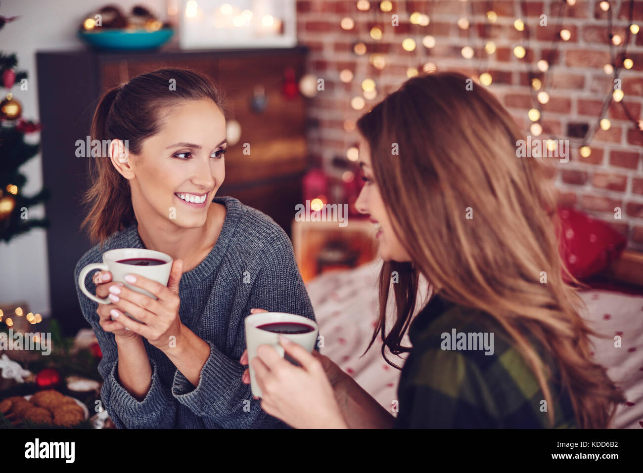 Friends drinking tea and chatting Stock Photo - Alamy