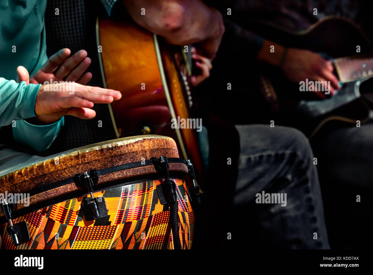 A small acoustic band performing tunes on a street in the District of ...
