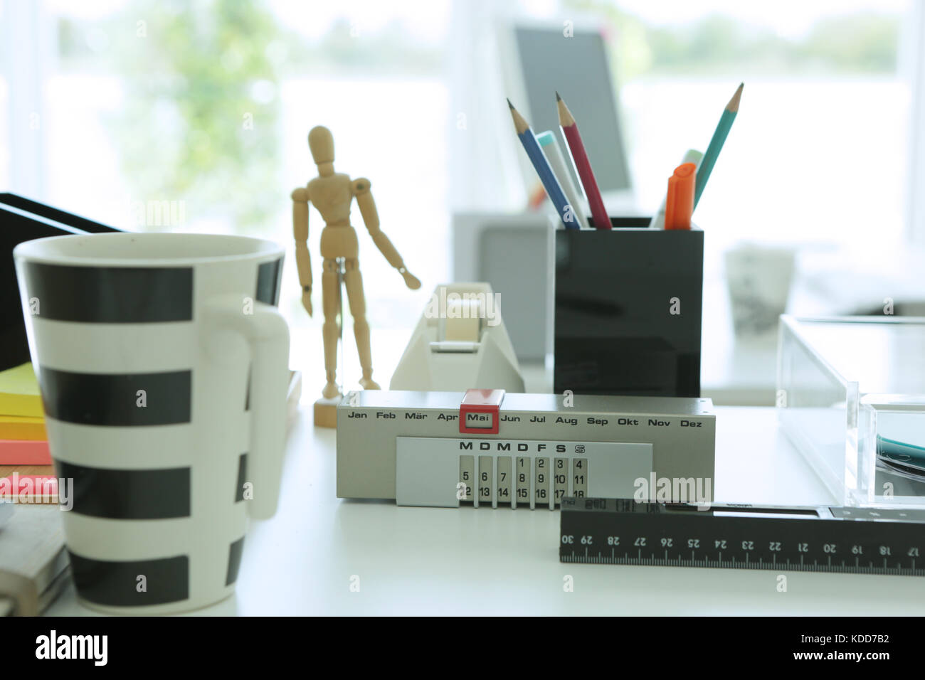 some stuff on a architect desktop in modern office Stock Photo - Alamy