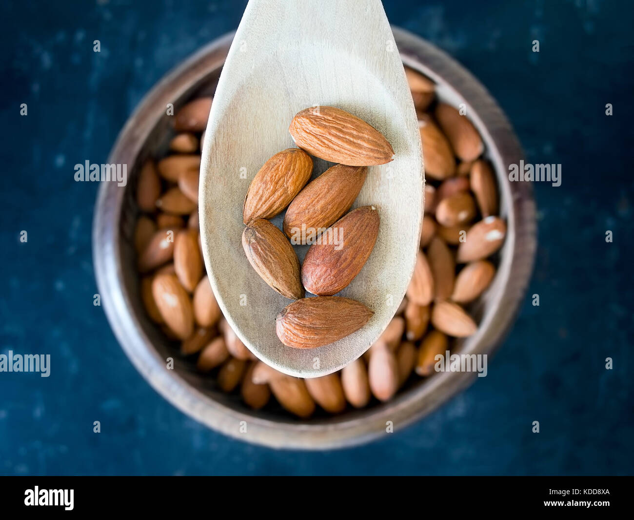 Almonds closeup on dark rustic background Stock Photo - Alamy