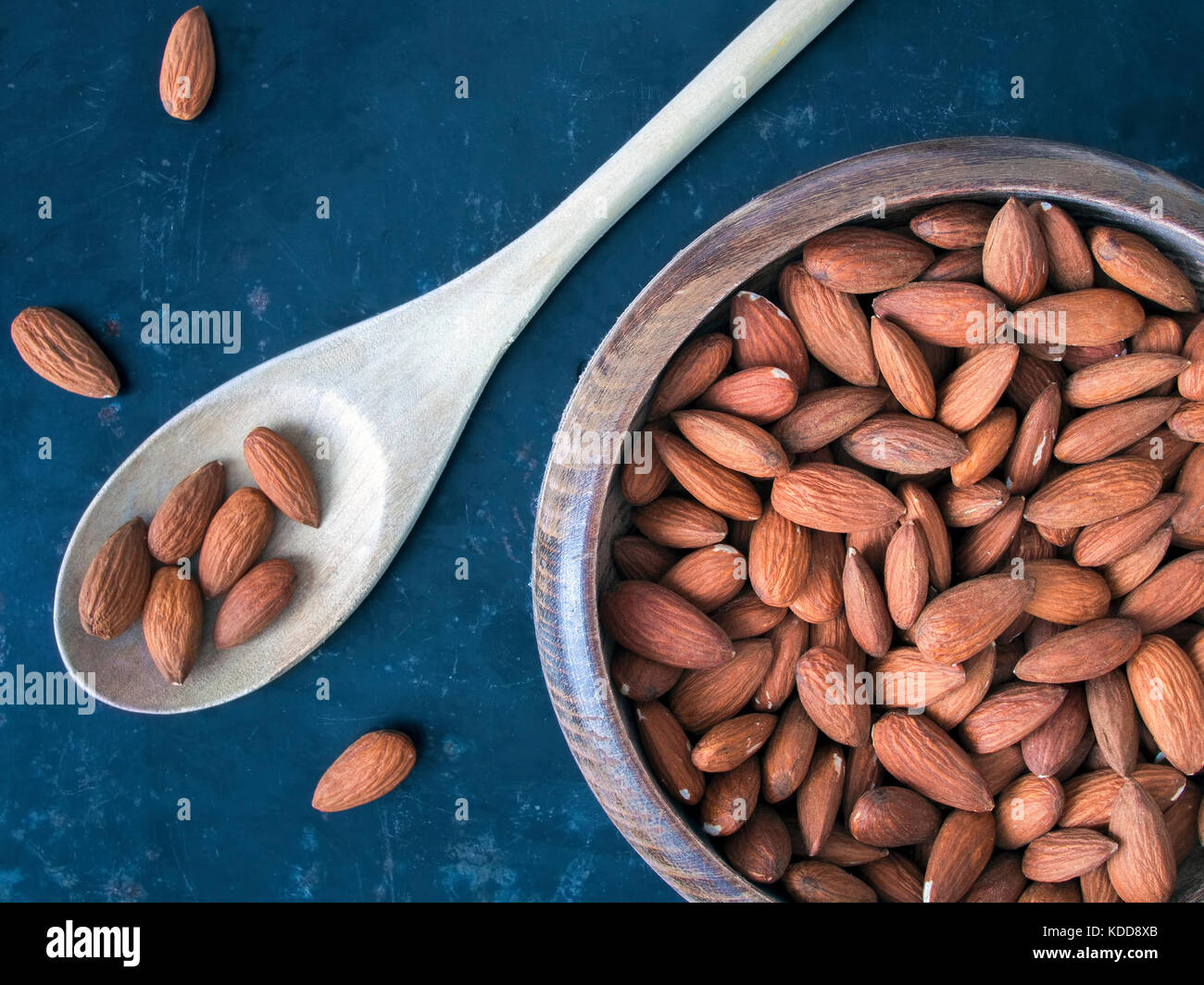 Almonds top view on a dark rustic background Stock Photo - Alamy