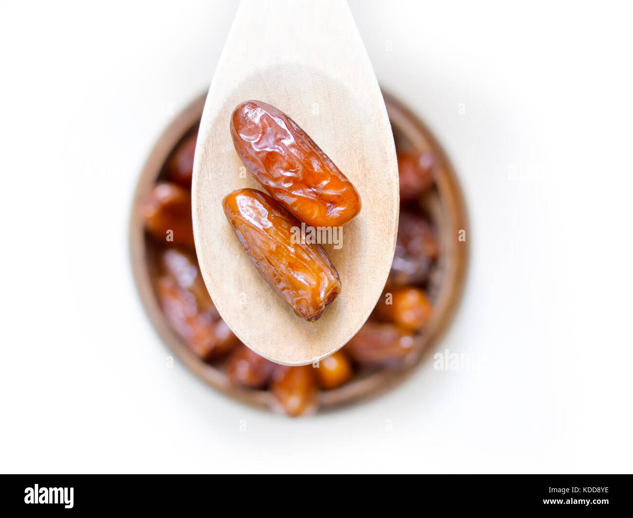 Dates fruit closeup isolated on white background Stock Photo - Alamy