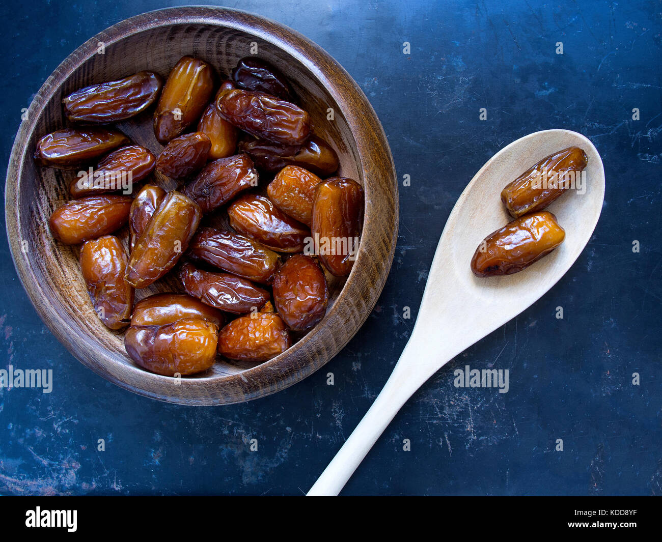 Dates fruit on dark rustic background, top view Stock Photo - Alamy