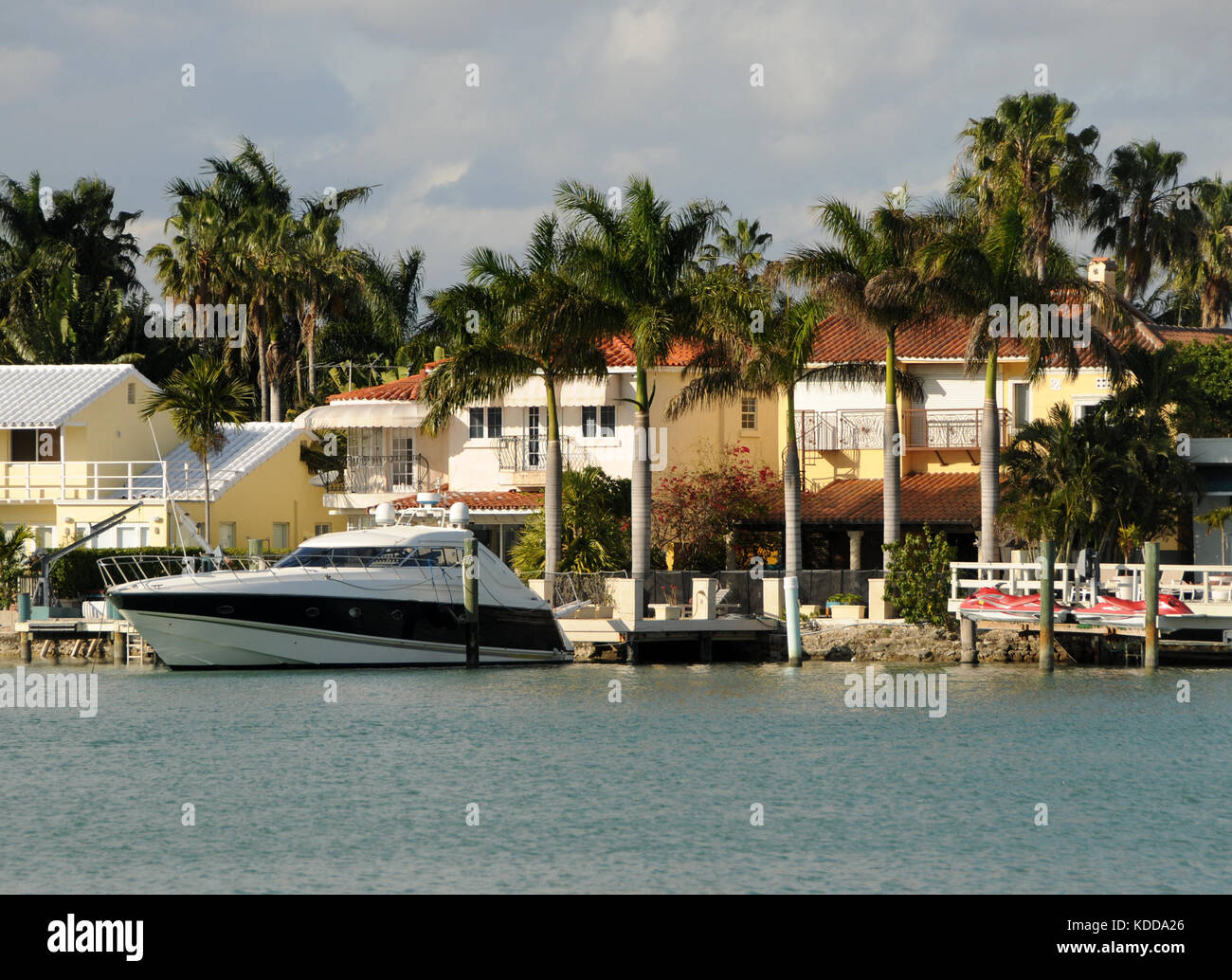 Luxury waterfront home and motor boat in Miami Stock Photo - Alamy