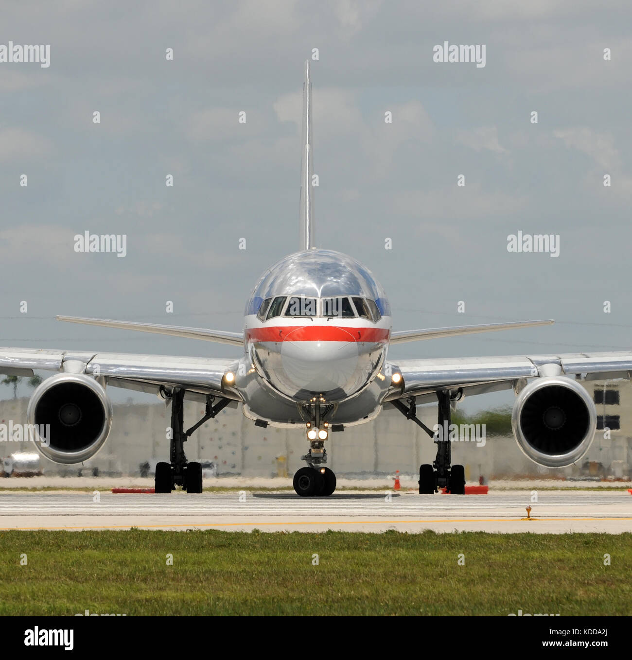 Passenger jet airplane taxiing front view Stock Photo - Alamy