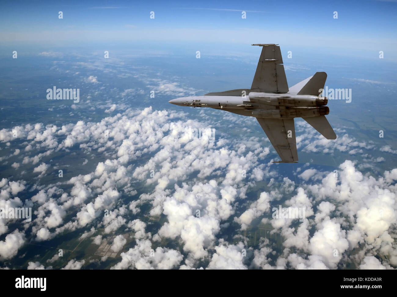 Modern Navy fighter jet flying high in the sky Stock Photo - Alamy