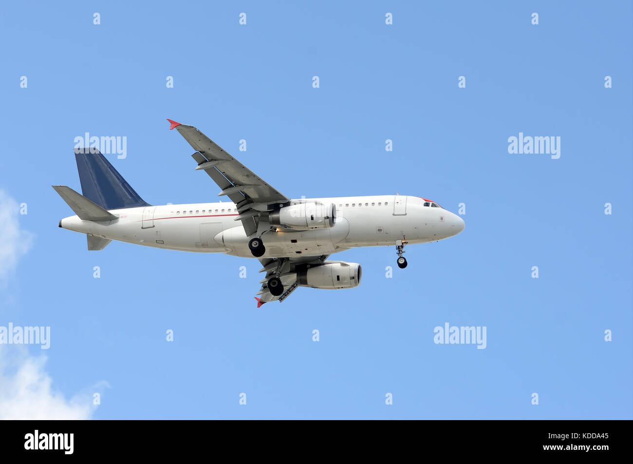 Modern passenger jet airplane in flight side view Stock Photo - Alamy