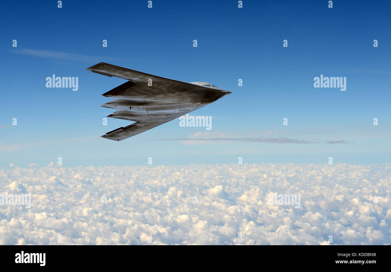 Modern stealth bomber flying at high altitude Stock Photo - Alamy