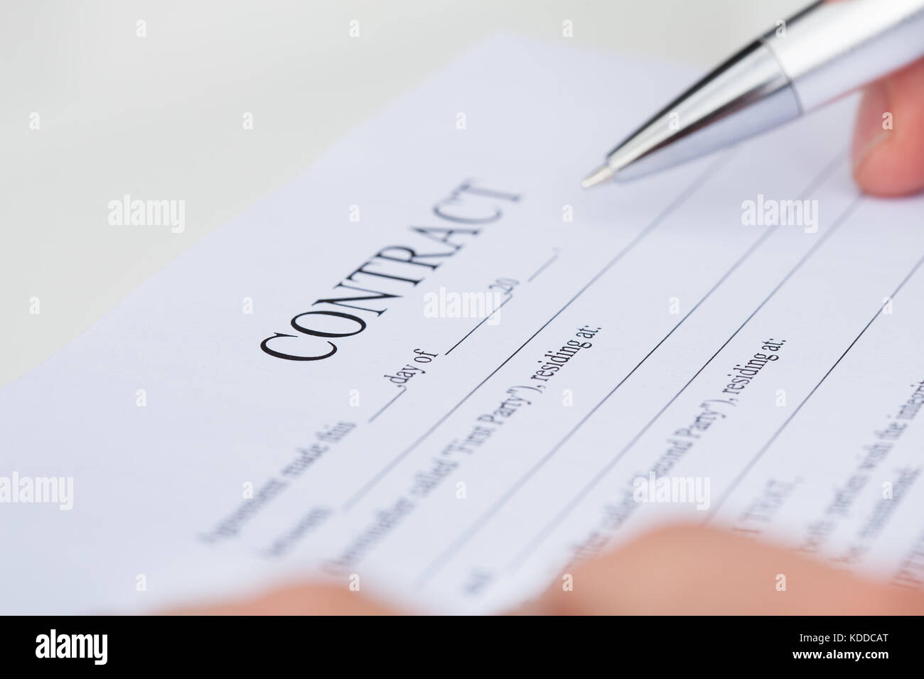 Close-up Of A Businessman Reading Contract Paper Stock Photo - Alamy
