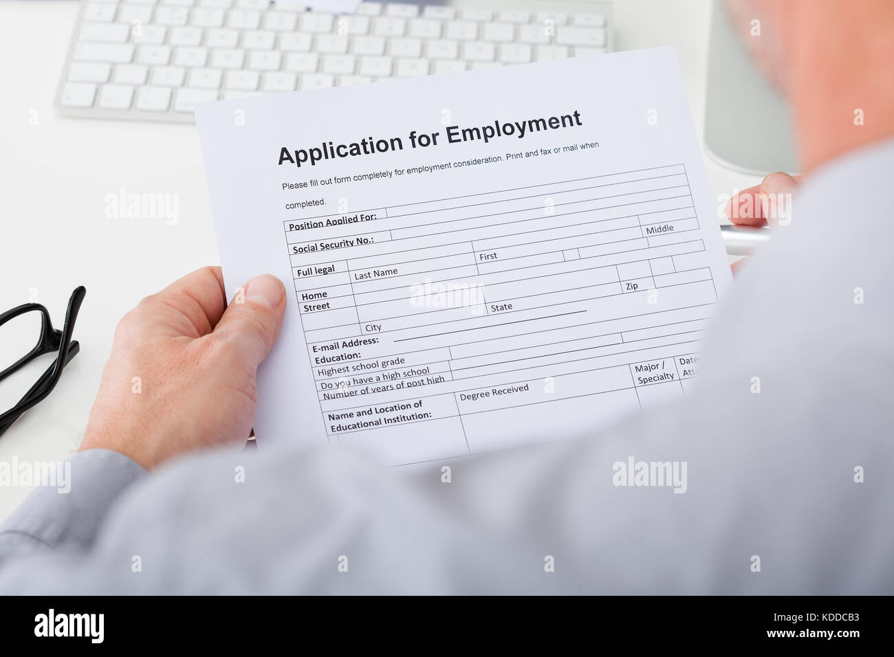 Close-up Of Hand Filling Application For Employment Stock Photo - Alamy