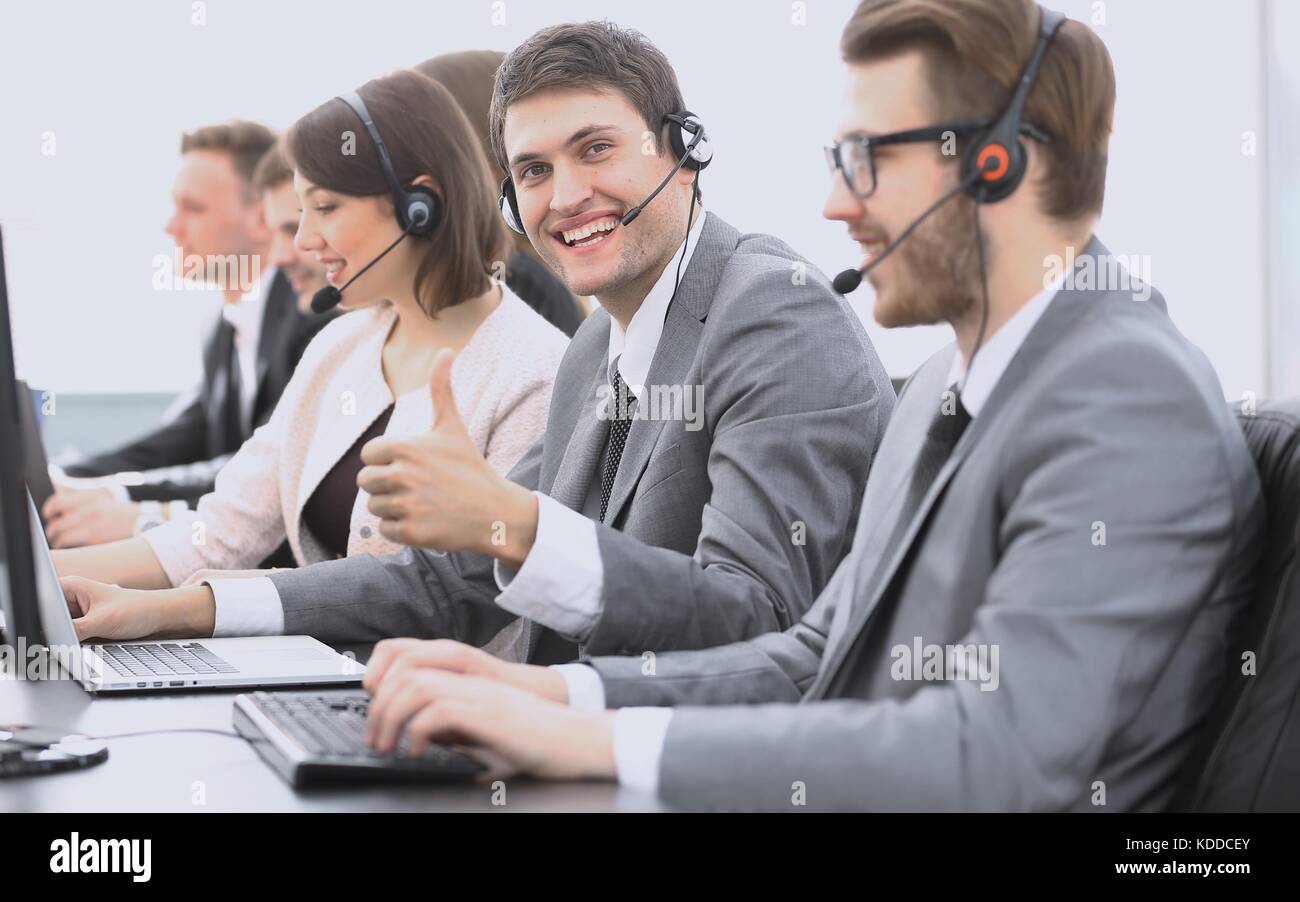 employee call center with headset showing thumb up Stock Photo - Alamy