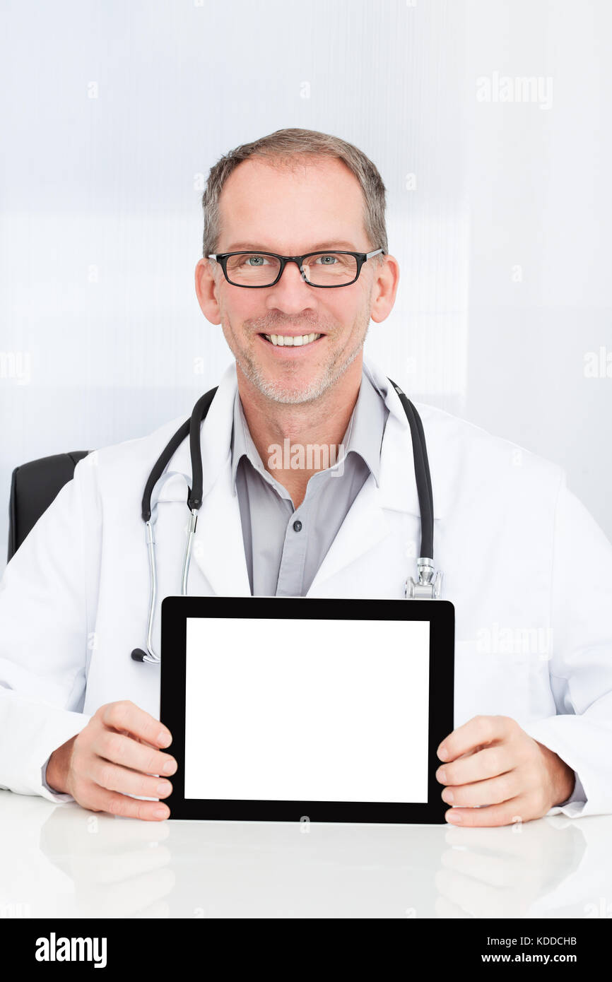 Senior people holding digital tablet hi-res stock photography and ...