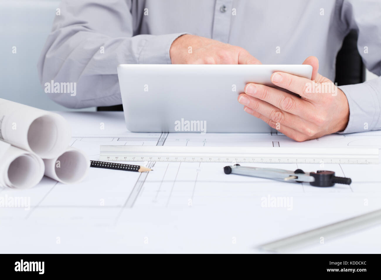 Close-up Of Architect Using Digital Tablet Over Blueprint Stock Photo ...
