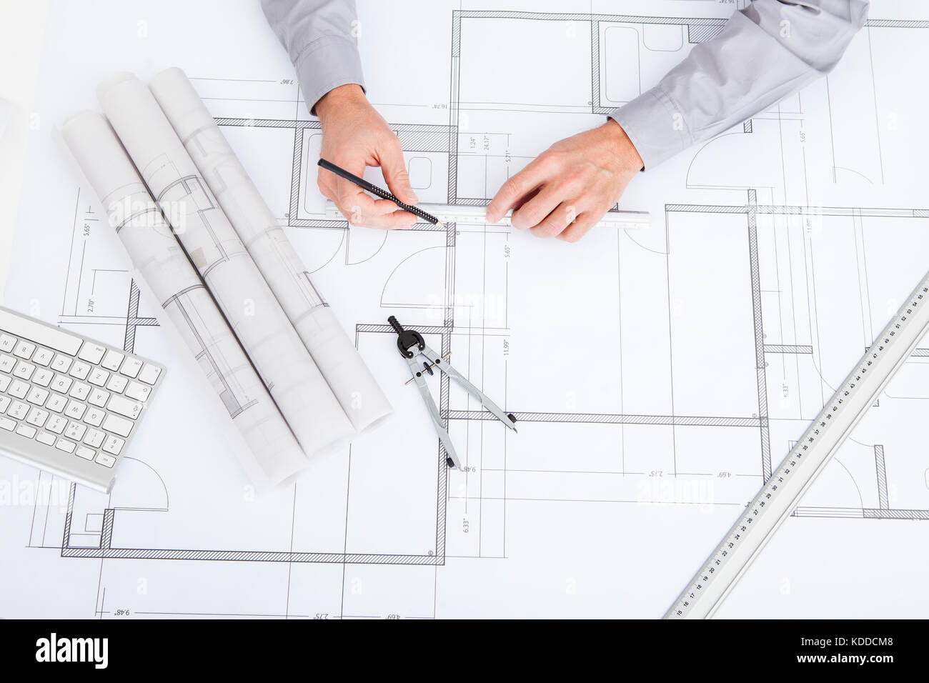 Close-up Of Person's Hand Drawing Plan On Blue Print Stock Photo - Alamy