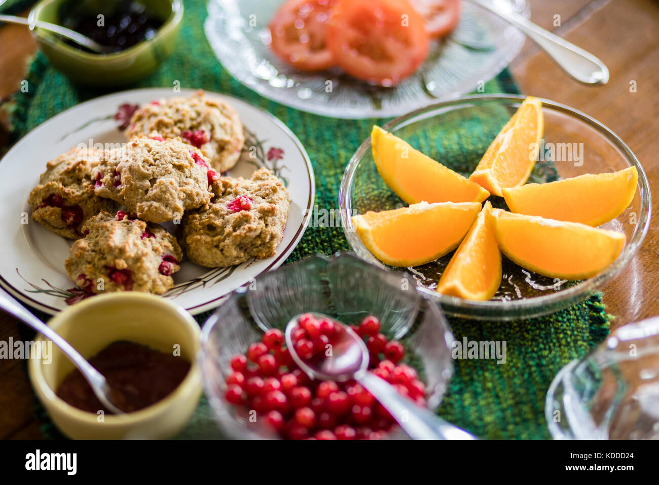 An outdoor light breakfast table buffet with fruits and biscuits Stock ...