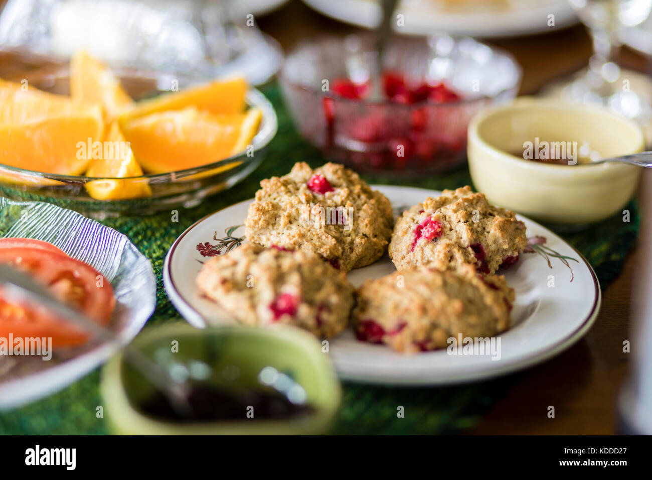 An outdoor light breakfast table buffet with fruits and biscuits Stock ...
