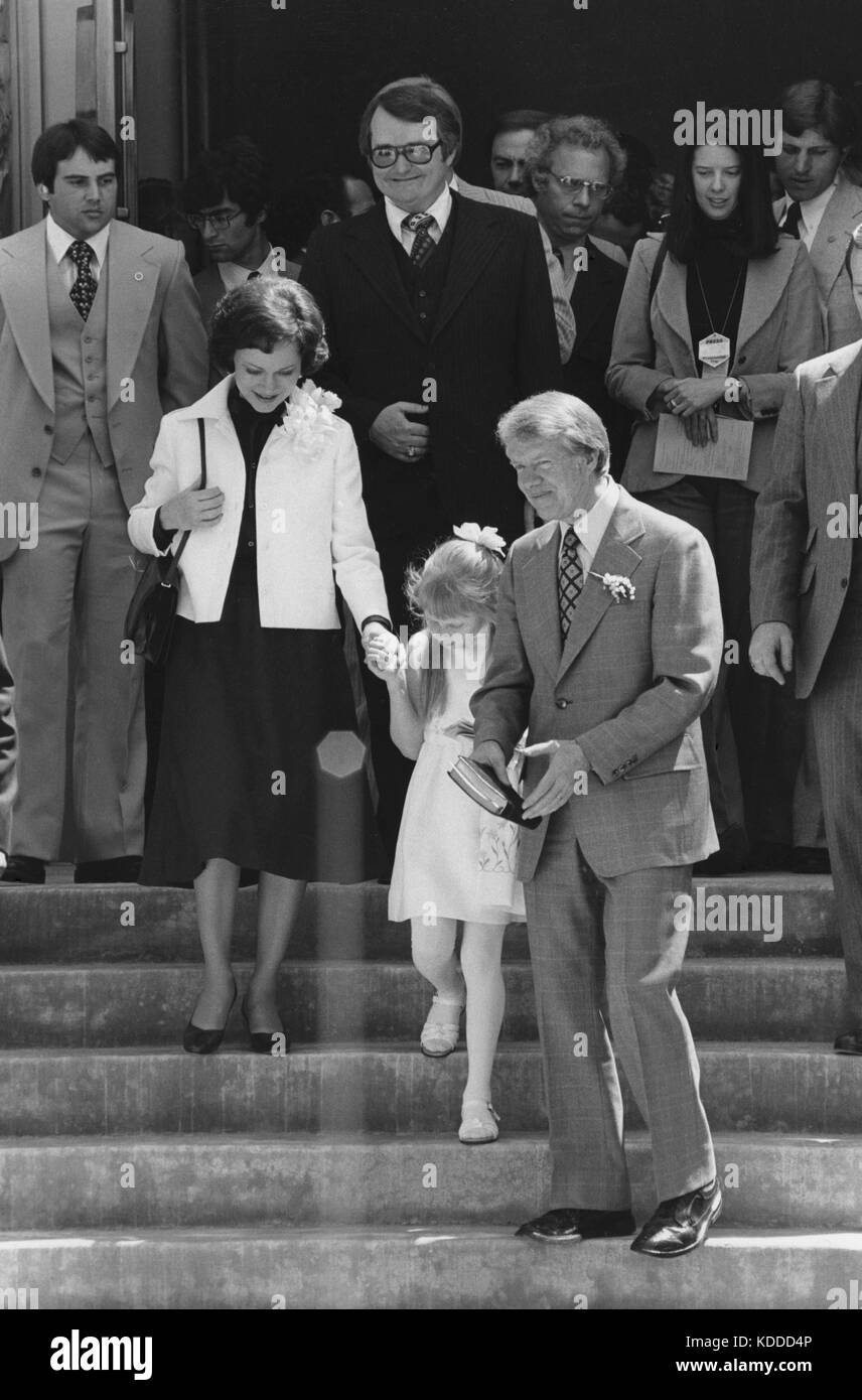 President Jimmy Carter leaves a 1977 church service with Rosalyn and ...