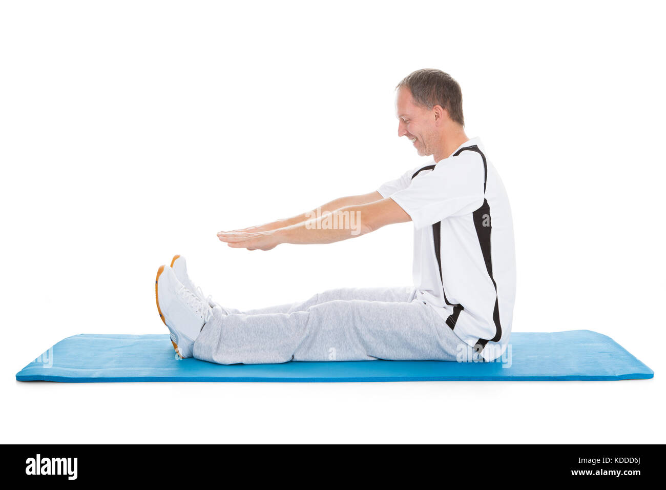 Portrait Of Mature Man Exercising Over White Background Stock Photo - Alamy