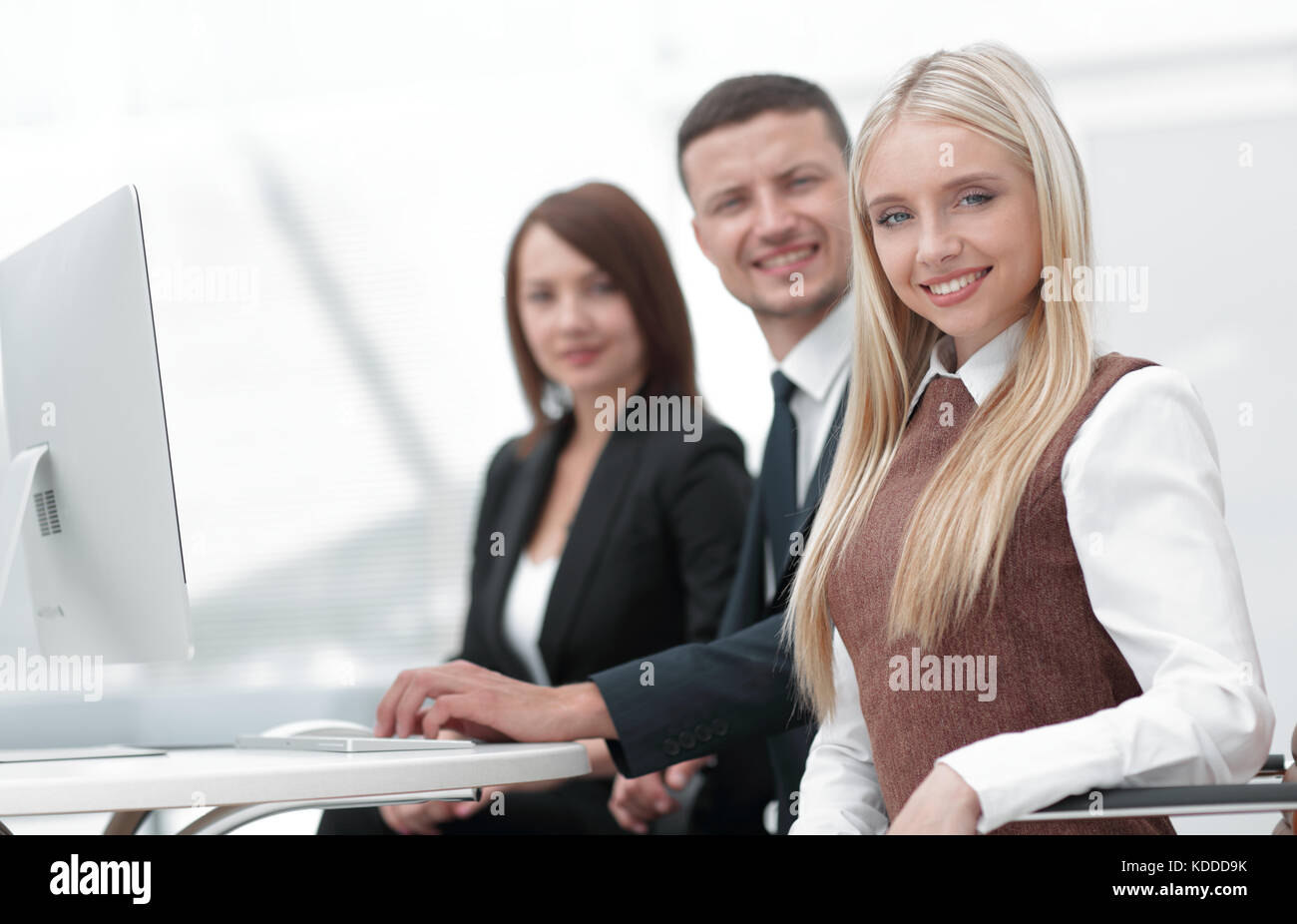 professional business team working while sitting at Desk Stock Photo ...