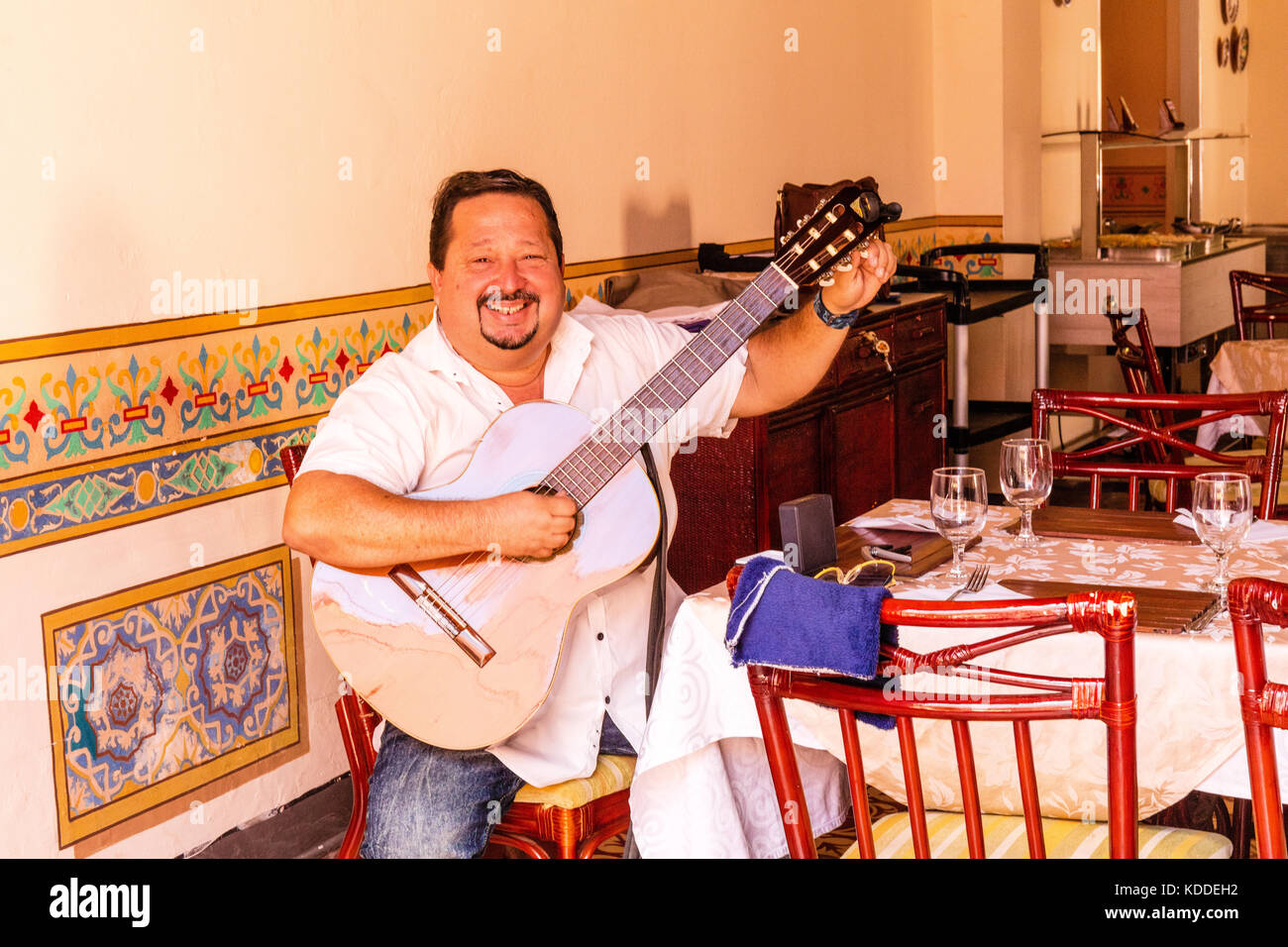 Cuban musician playing guitar music in local restaurant, Trinidad, Cuba ...