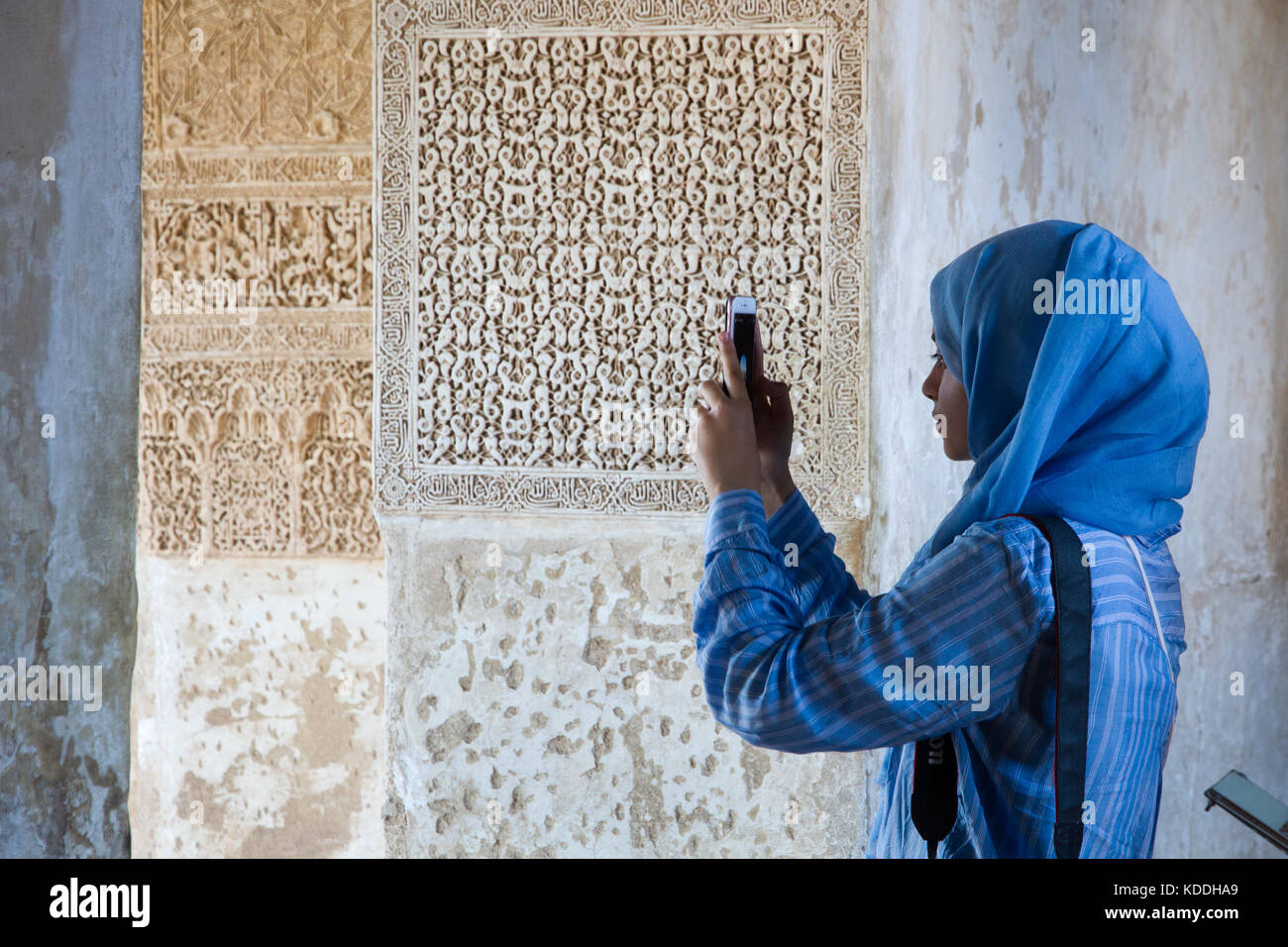 Alhambra Granada interior scene, muslim woman visiting the last one ...