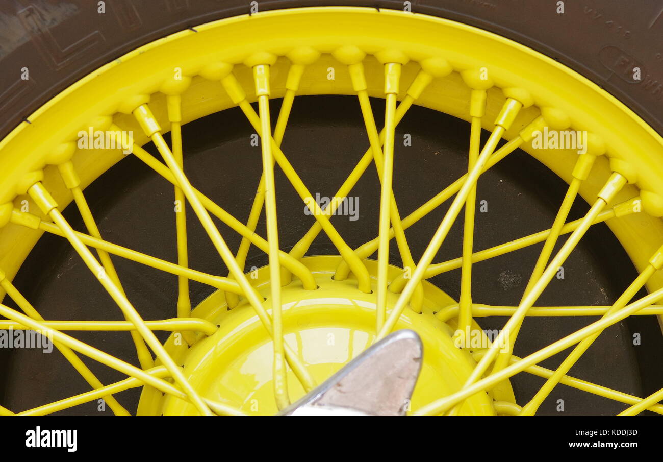 Yellow steel wheel of a vintage car, Jaguar Stock Photo - Alamy