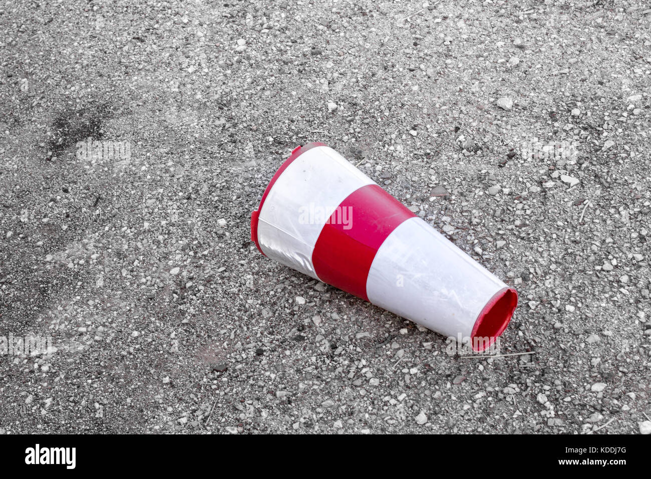 broken street cone fallen on the asphalt during a car accident accident ...