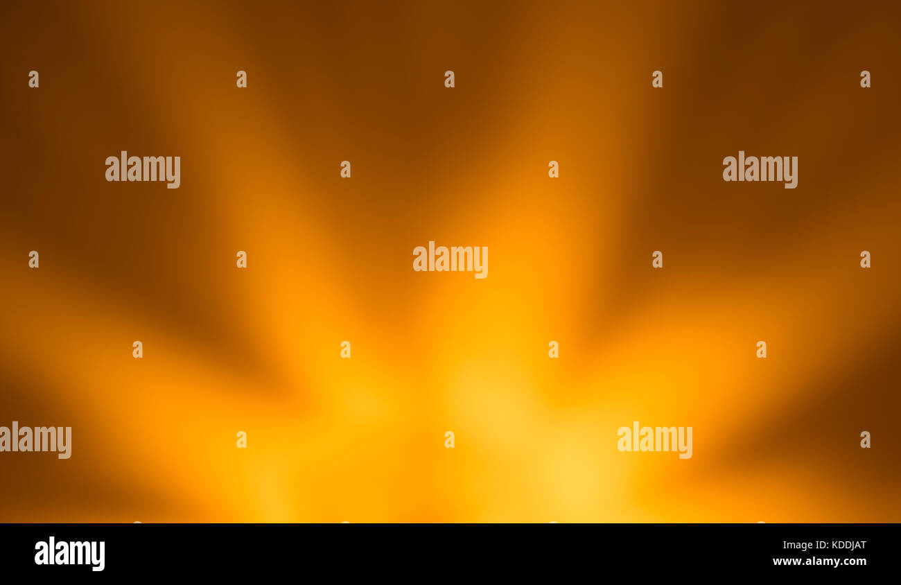 blur spotlight effect on orange background free place Stock Photo - Alamy